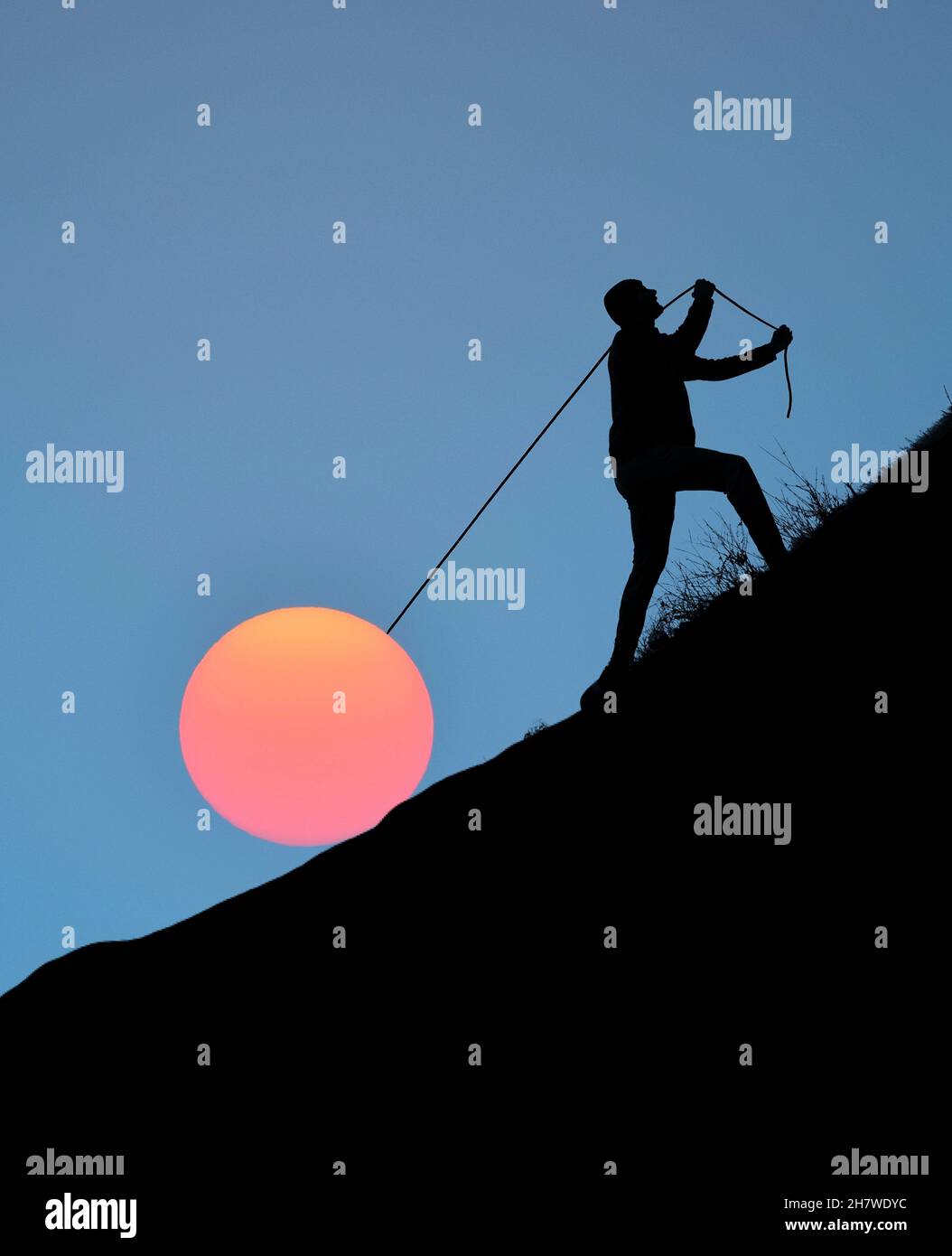 A man pulling the setting sun up a hill. HARYANA, INDIA: TRICK-of-the ...