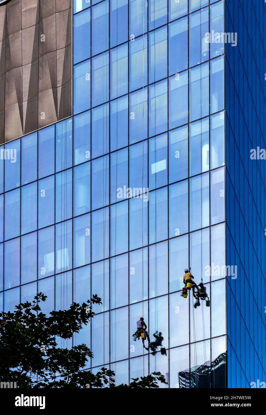 Warsaw, Mazovia / Poland - 2020/08/09: Glass wall cleaners hanging by ...