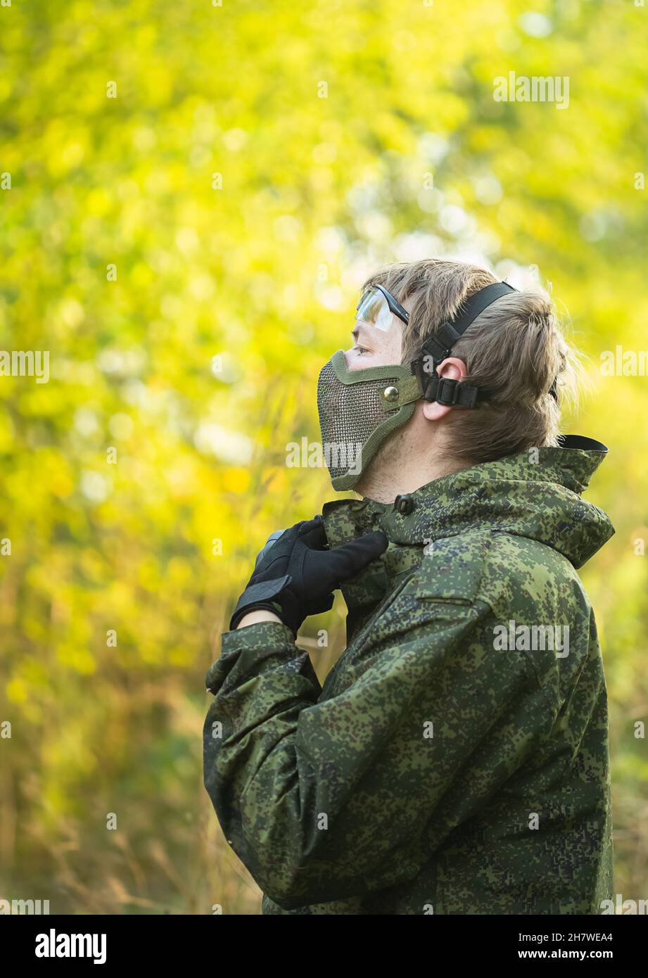 Portrait of Fully equipped military men in security mask with automatic ...