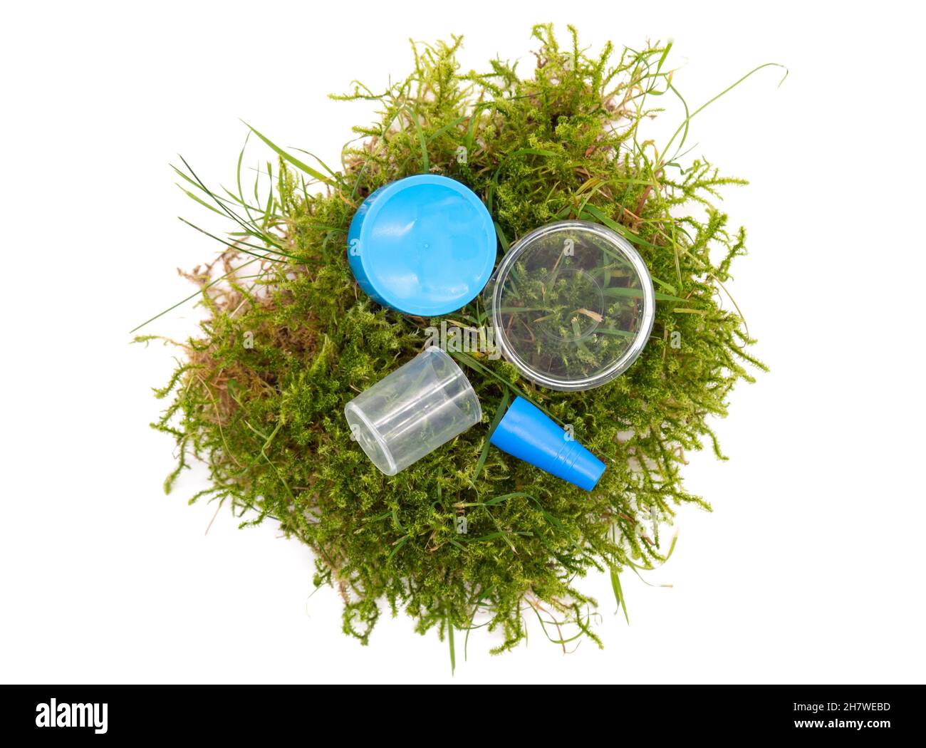 Plastic garbage in nature on white background Stock Photo - Alamy