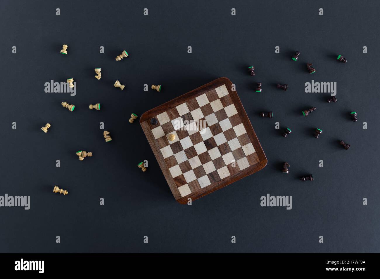 Souvenir wooden chess on a dark background. Intellectual board game Stock Photo - Alamy