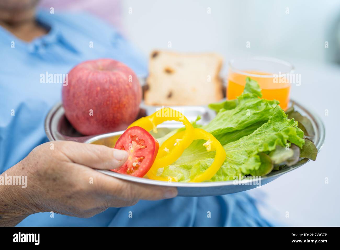 Asian senior or elderly old lady woman patient eating breakfast ...