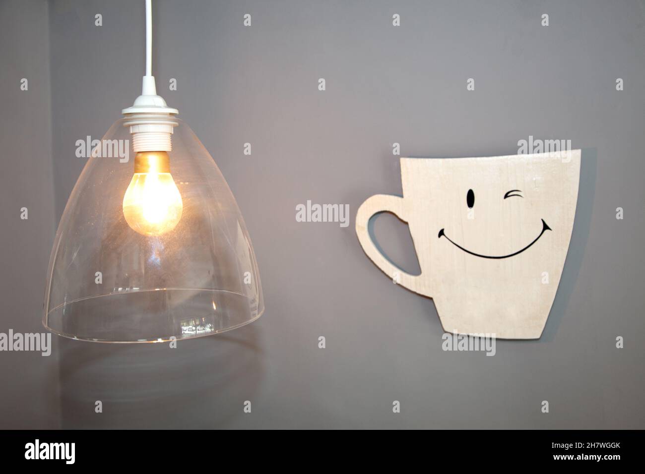 Wall with poster. Light with yellow bulb. Poster with message Stock ...