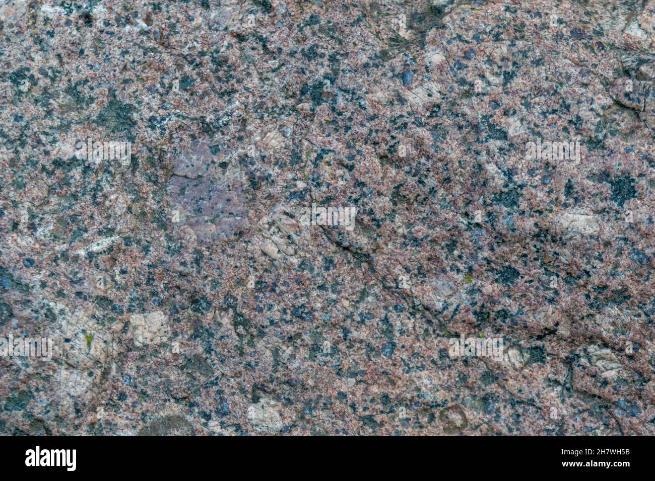 The texture of the old stone. Granite. Variegated colors, natural ...