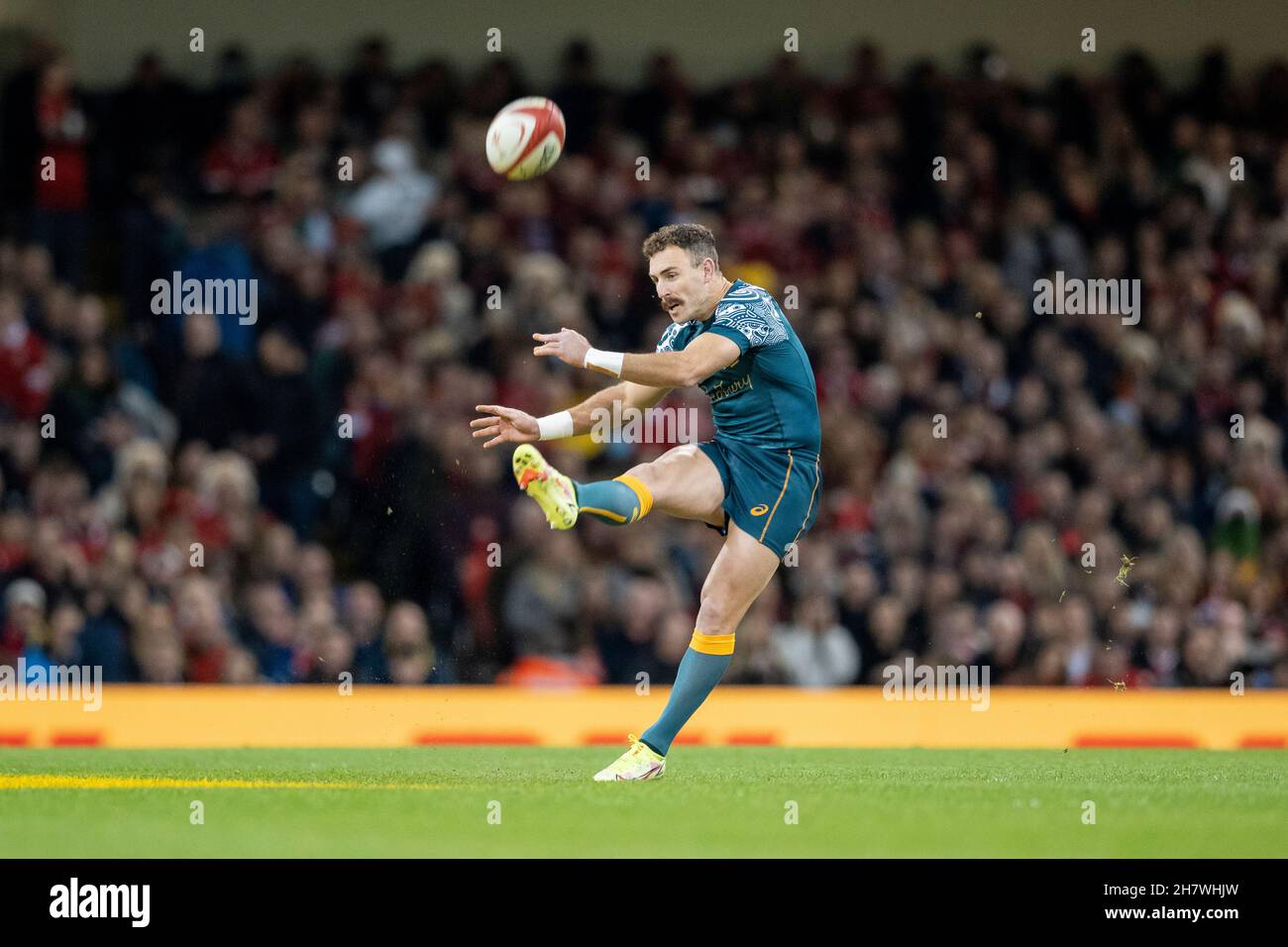 Australian scrum half, Nic White, kicks the match off in Cardiff Stock ...