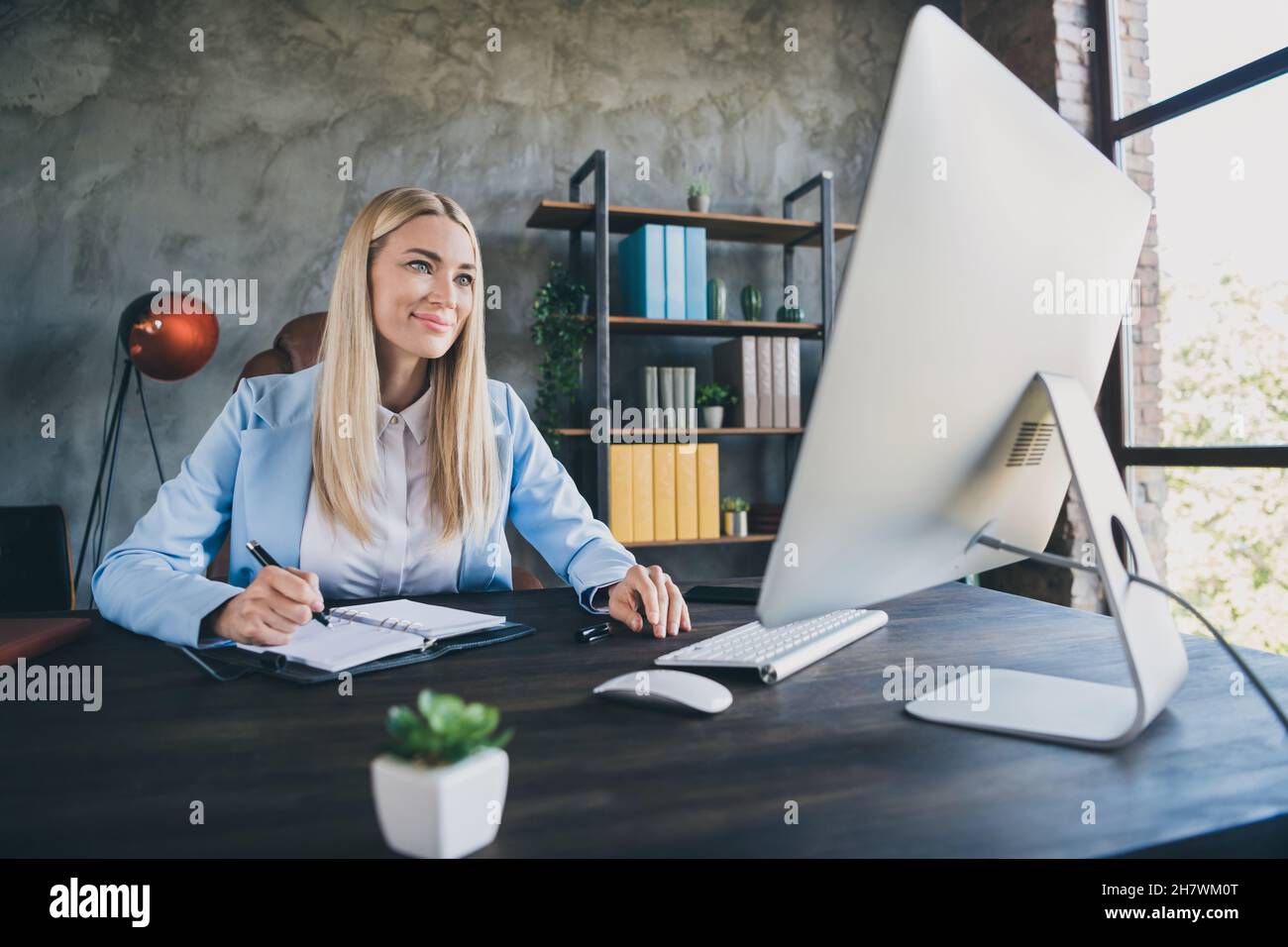Photo of boss lawyer secretary lady sit desk use pc device write ...