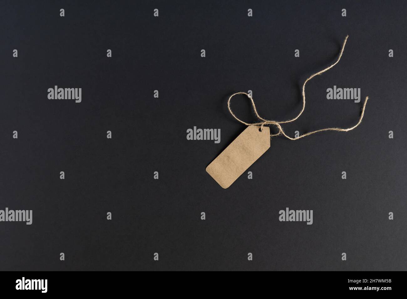 On a dark background, an empty shopping label, a price tag made of ...