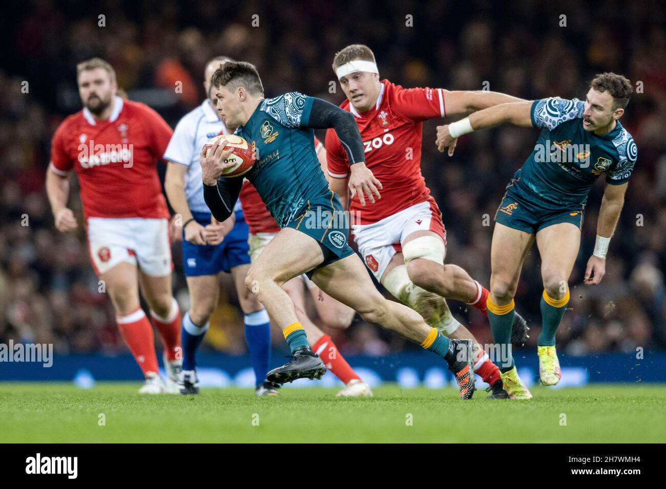 Australian fly half, James O'Connor, darks across field ahead of the ...