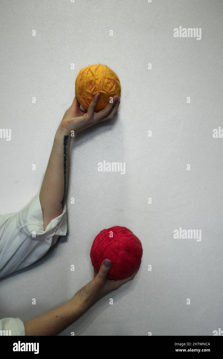 Hands holding balls hi-res stock photography and images - Alamy