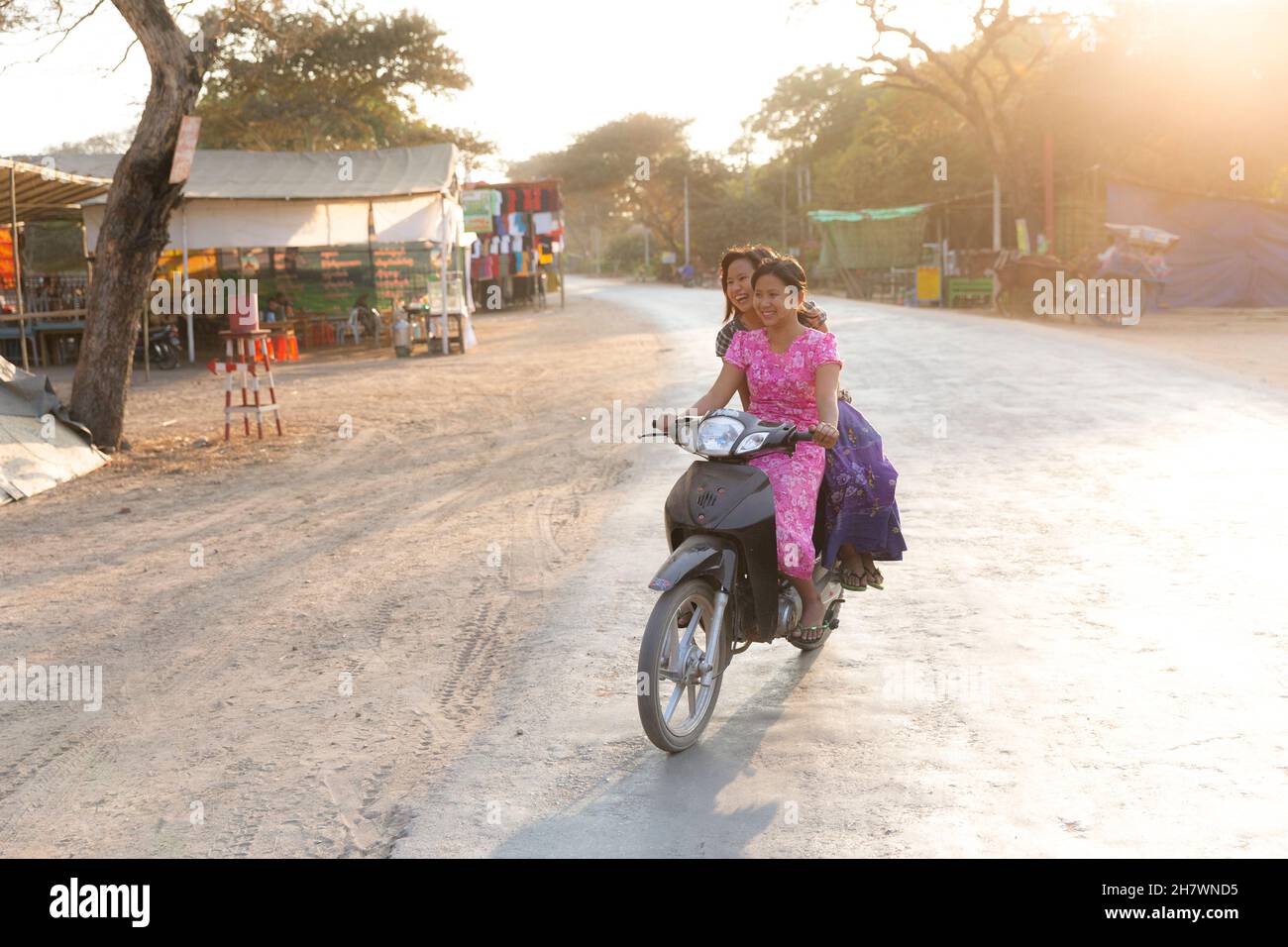 Women riding a scooter Stock Photo - Alamy