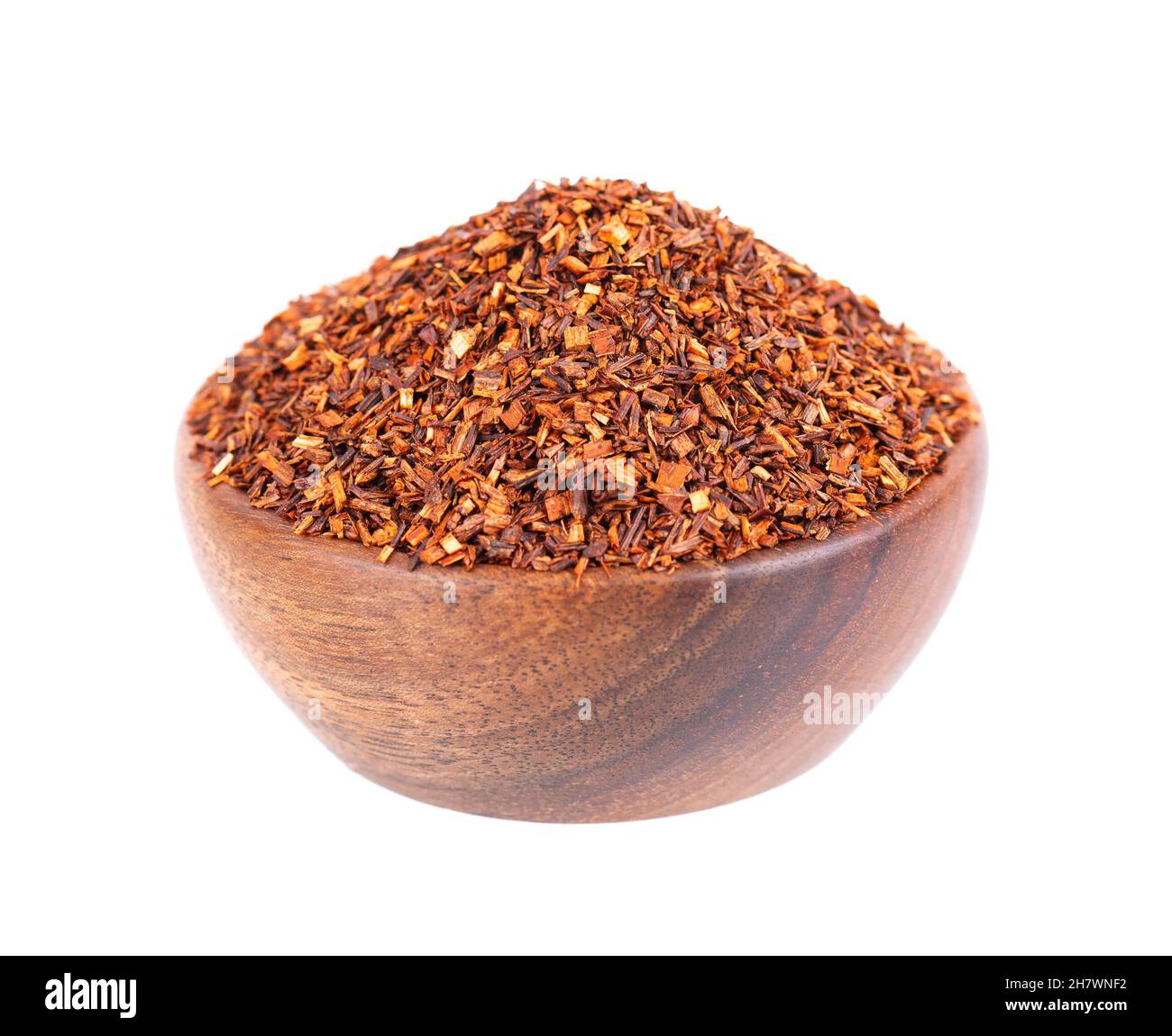 Rooibos red tea in wooden bowl, isolated on white background ...