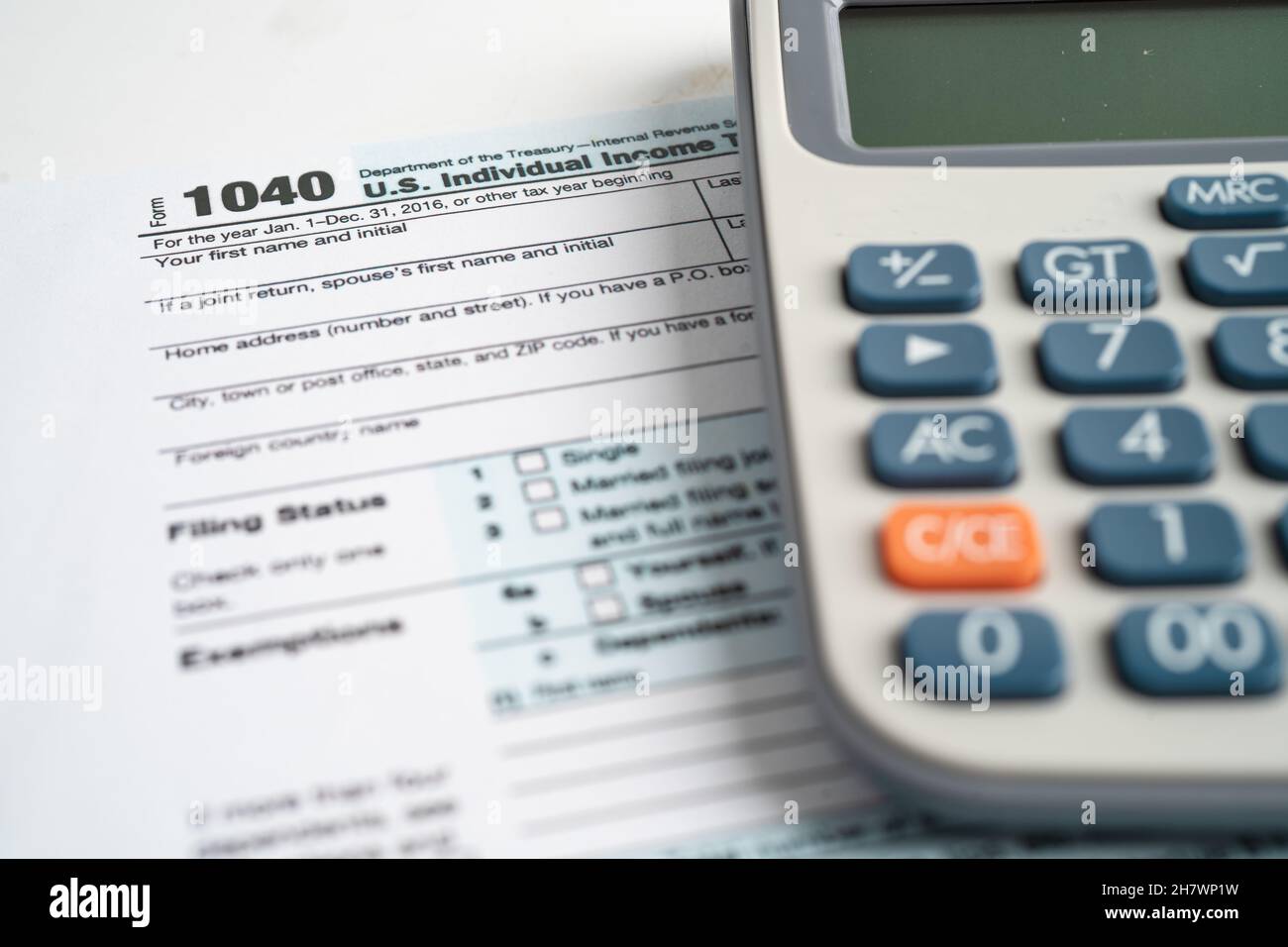 Tax Return form 1040 and dollar banknote, U.S. Individual Income Stock ...