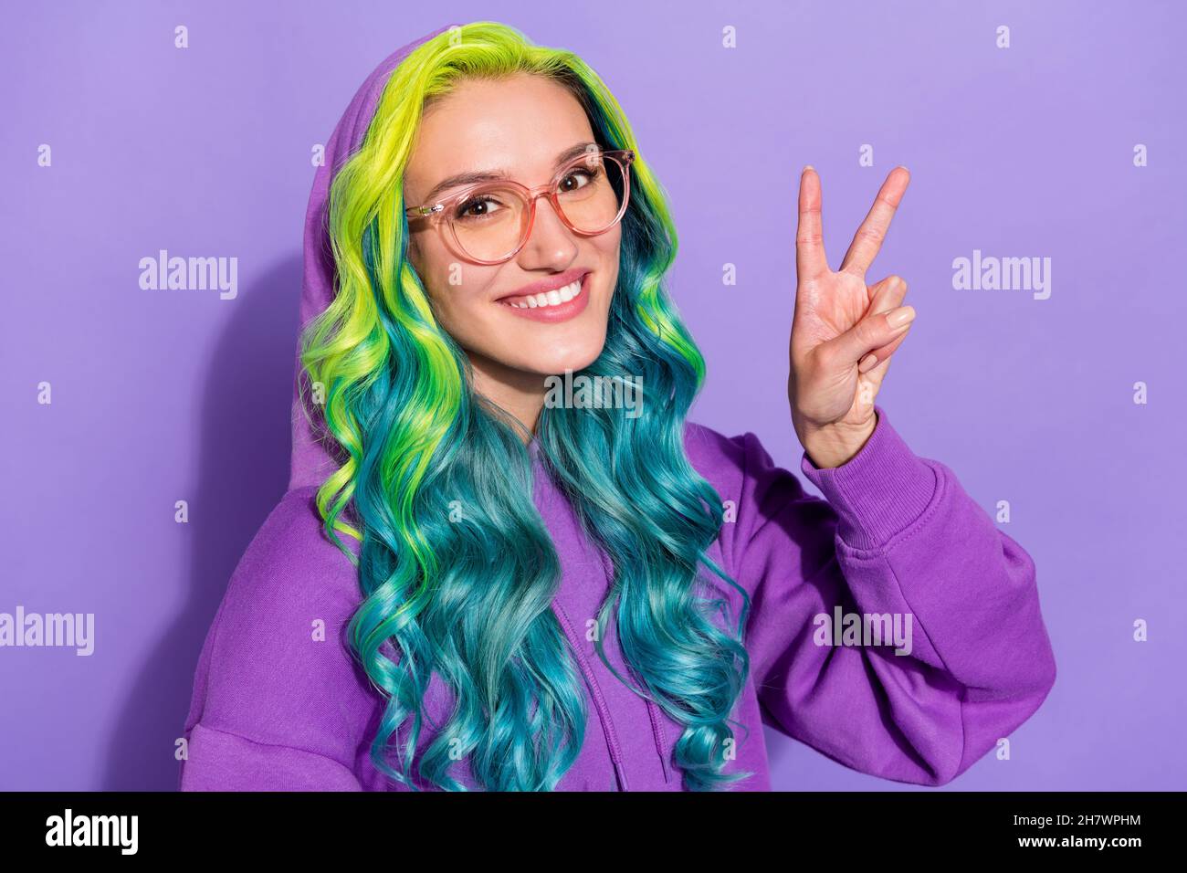 Photo of youngster lady geek with turquoise haircut make v-sign ...