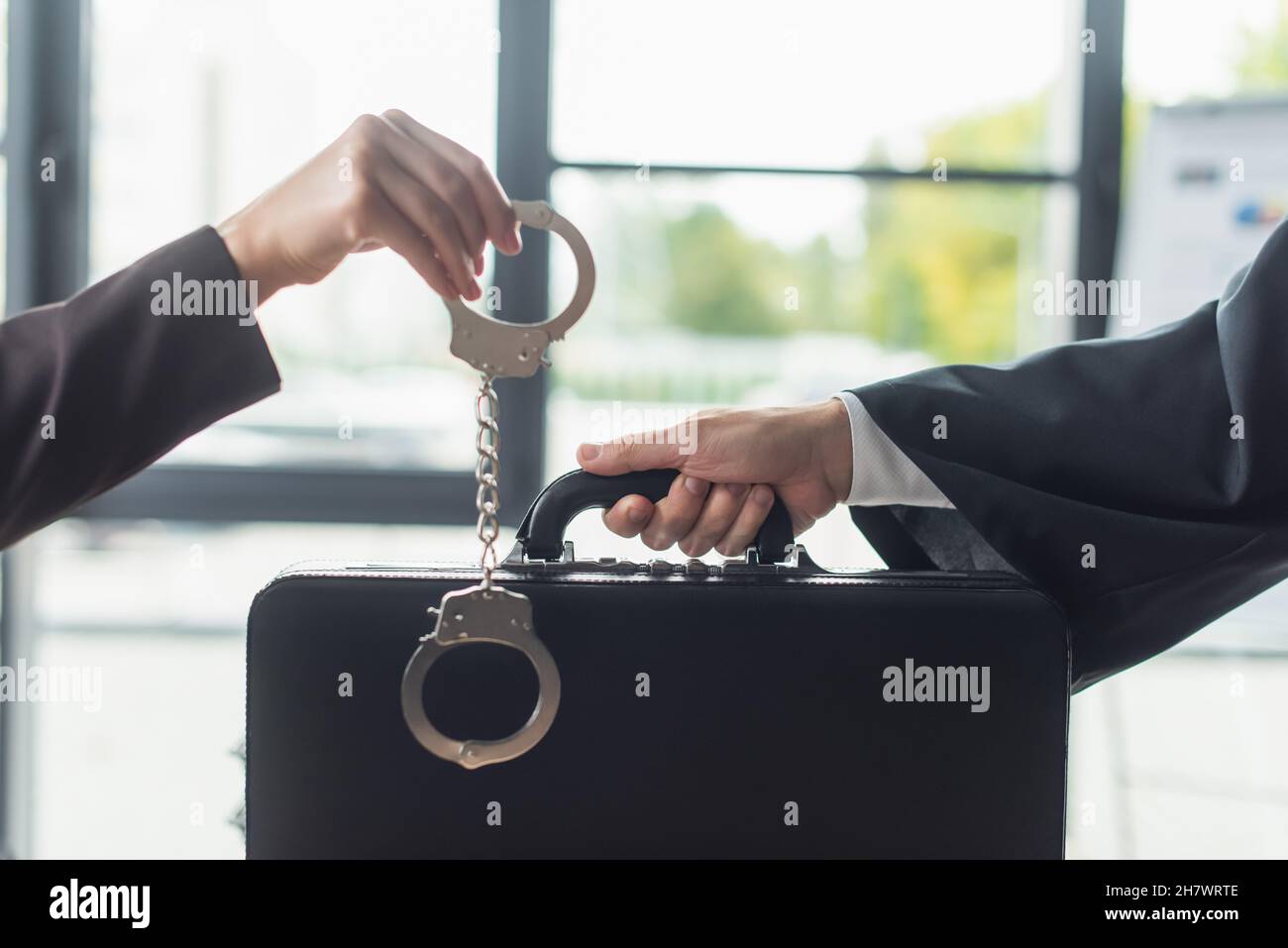 Woman with handcuffs hi-res stock photography and images - Alamy