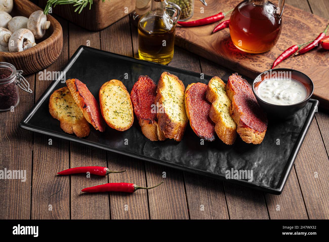 Fried garlic bread appetizer with sauce Stock Photo - Alamy