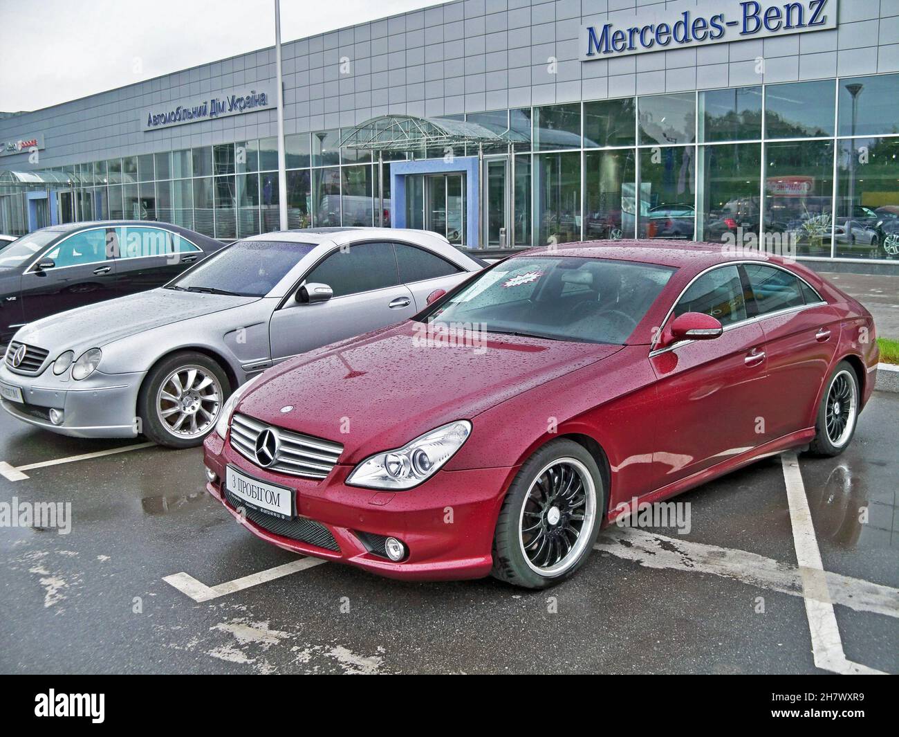 Kiev, Ukraine - August 18, 2010: Mercedes CLS 500 in red color. Wet car ...
