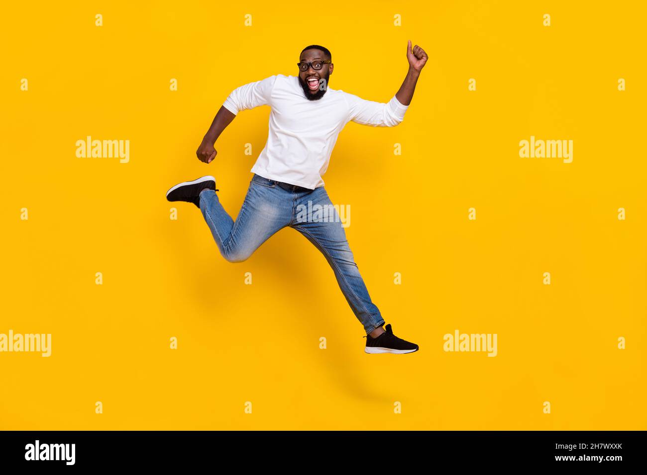 Full body photo of excited amazed sporty guy have fun rejoice free time ...