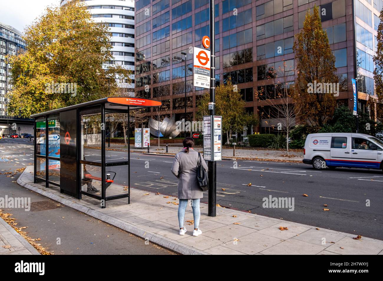 Woman standing bus stop hi-res stock photography and images - Alamy