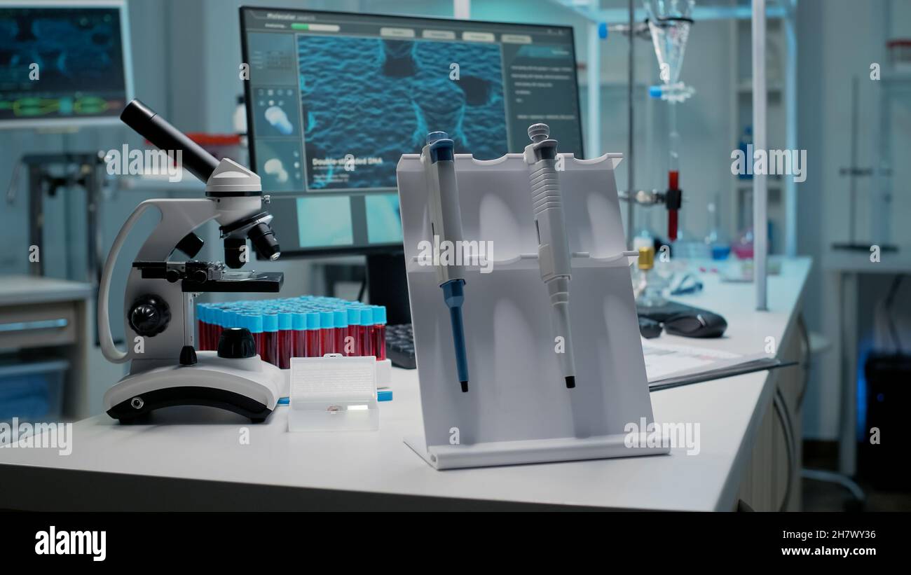 Close up of scientific micropipette and instruments in chemical ...