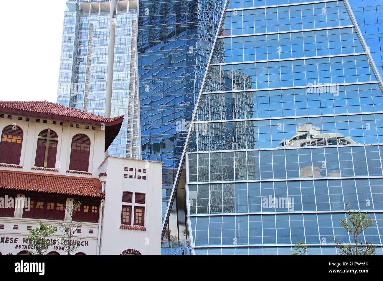 modern glass buildings and methodist church in singapore Stock Photo ...