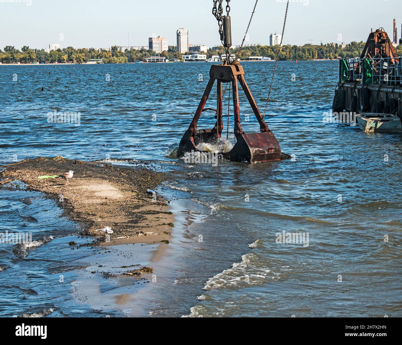 Cleaning the newly formed island from industrial waste on the Dnieper ...