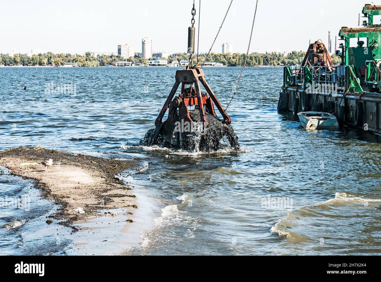 Cleaning the newly formed island from industrial waste on the Dnieper ...