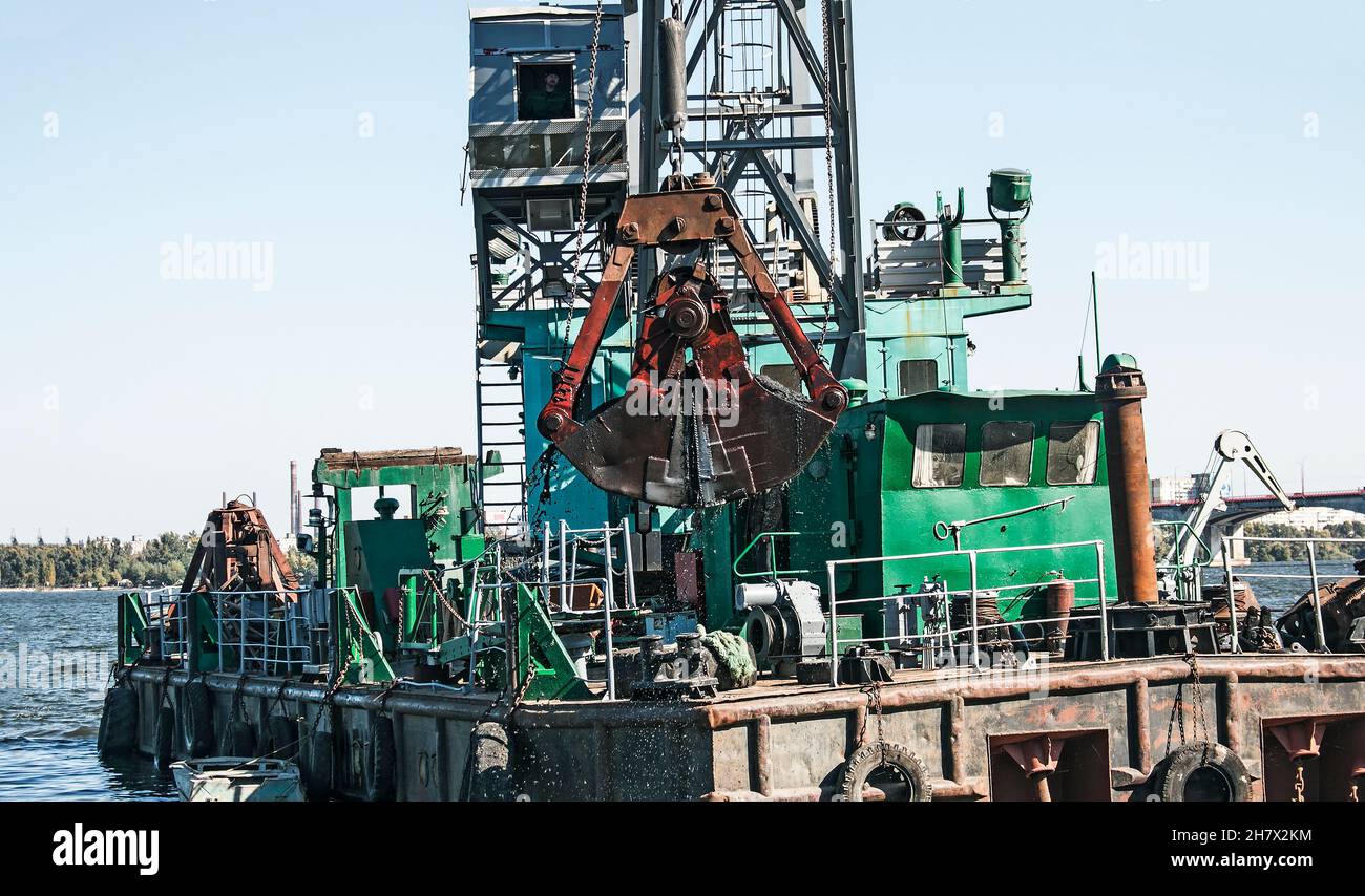Cleaning the newly formed island from industrial waste on the Dnieper ...