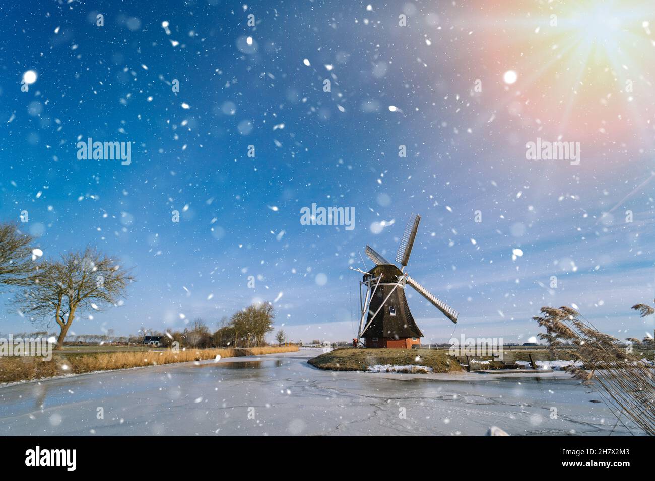 Typical winter dutch landscape with windmill. frozen canal in ...