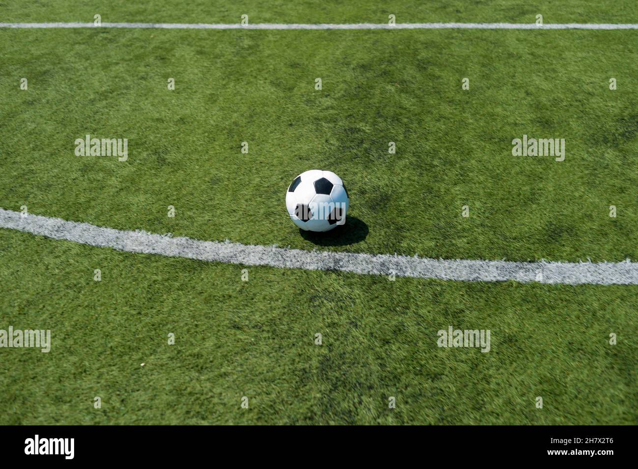 Traditional soccer ball on soccer field Stock Photo - Alamy