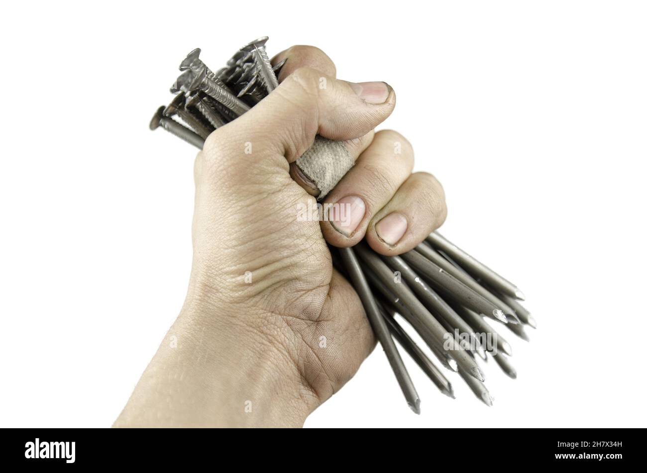 Man holding construction nails in his hand on a white isolated ...