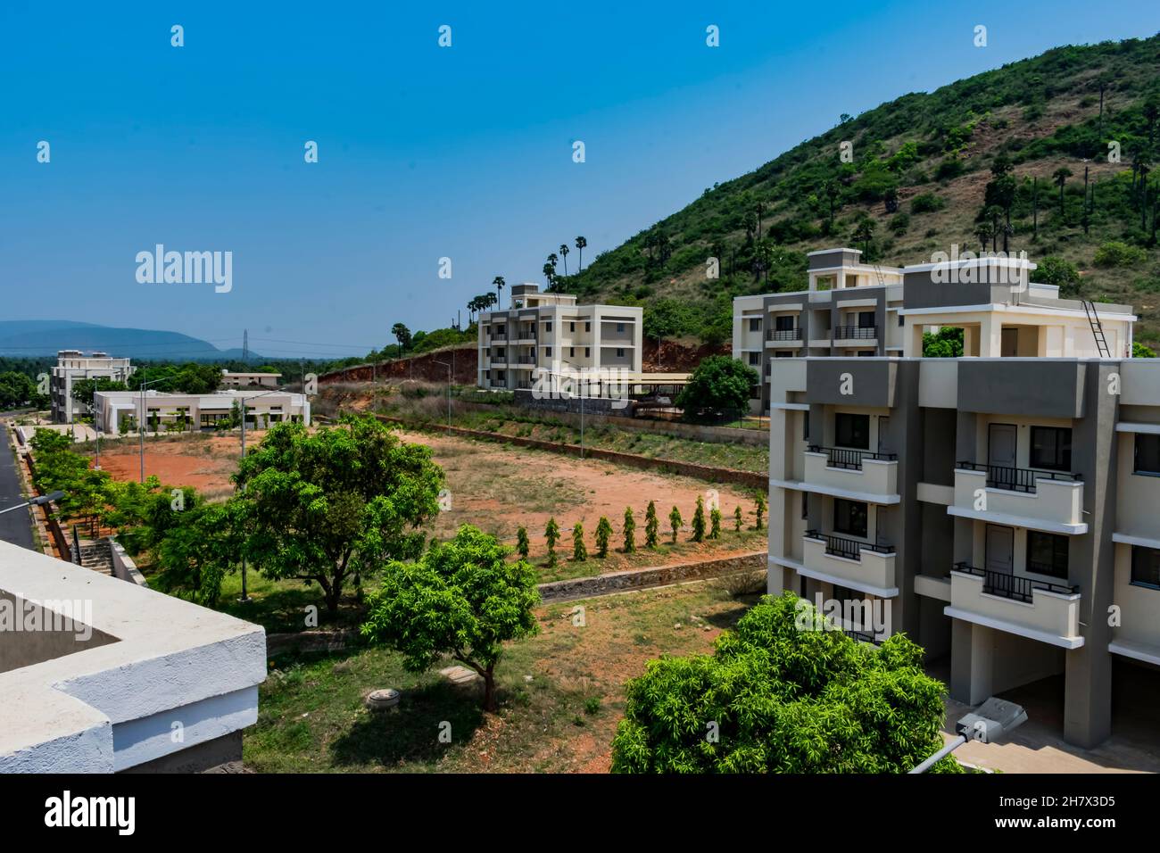 Top view of an Indian colony with bitumen road , building looking in ...
