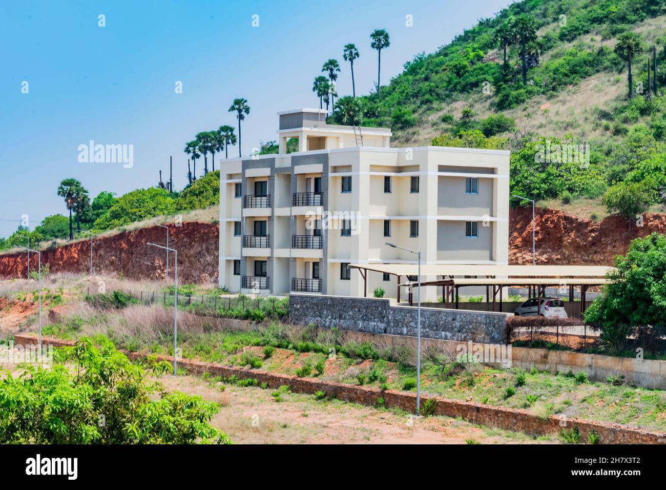 Top view of an Indian colony with bitumen road , building looking in ...