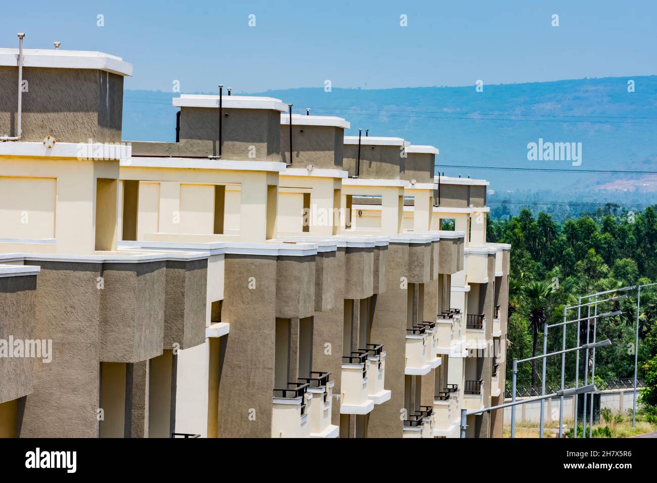 Top view of an Indian colony with bitumen road , building looking in ...