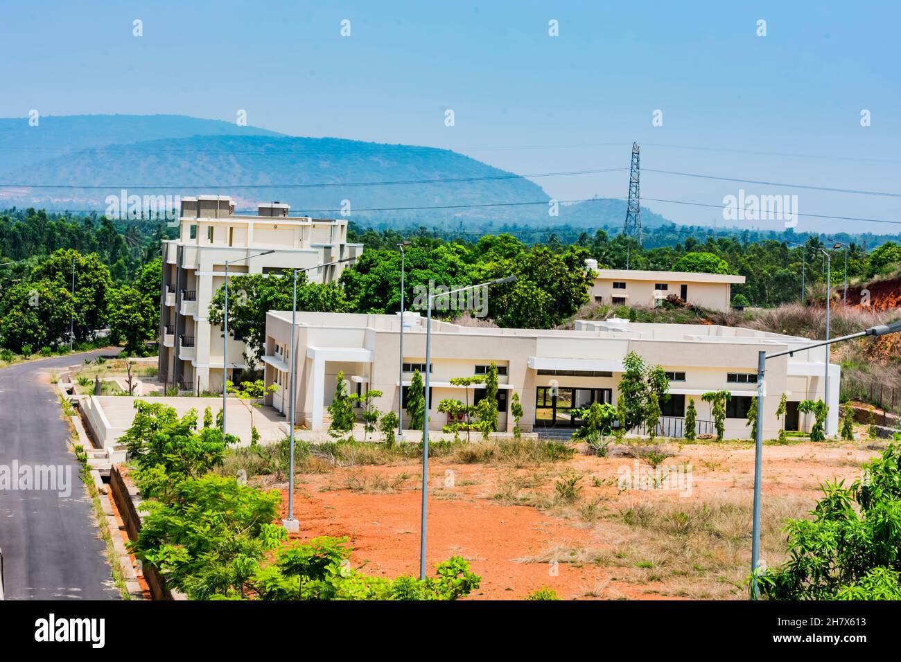 Top view of an Indian colony with bitumen road , building looking in ...