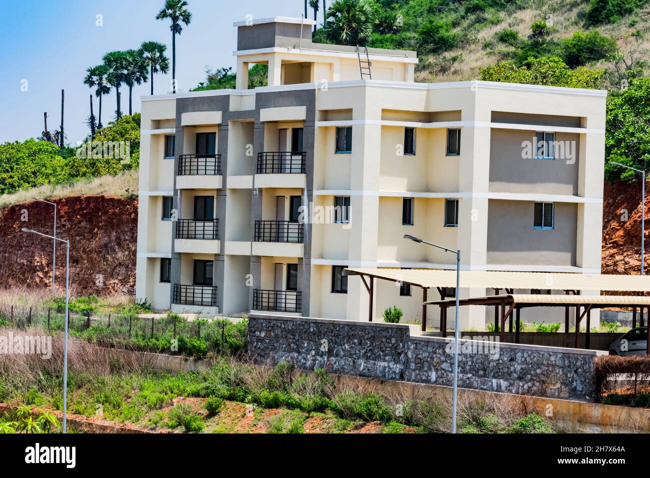 Top view of an Indian colony with bitumen road , building looking in ...