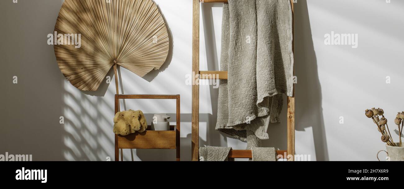 Organic handmade soap, sea sponge, waffle linen towels hanging on wood ...