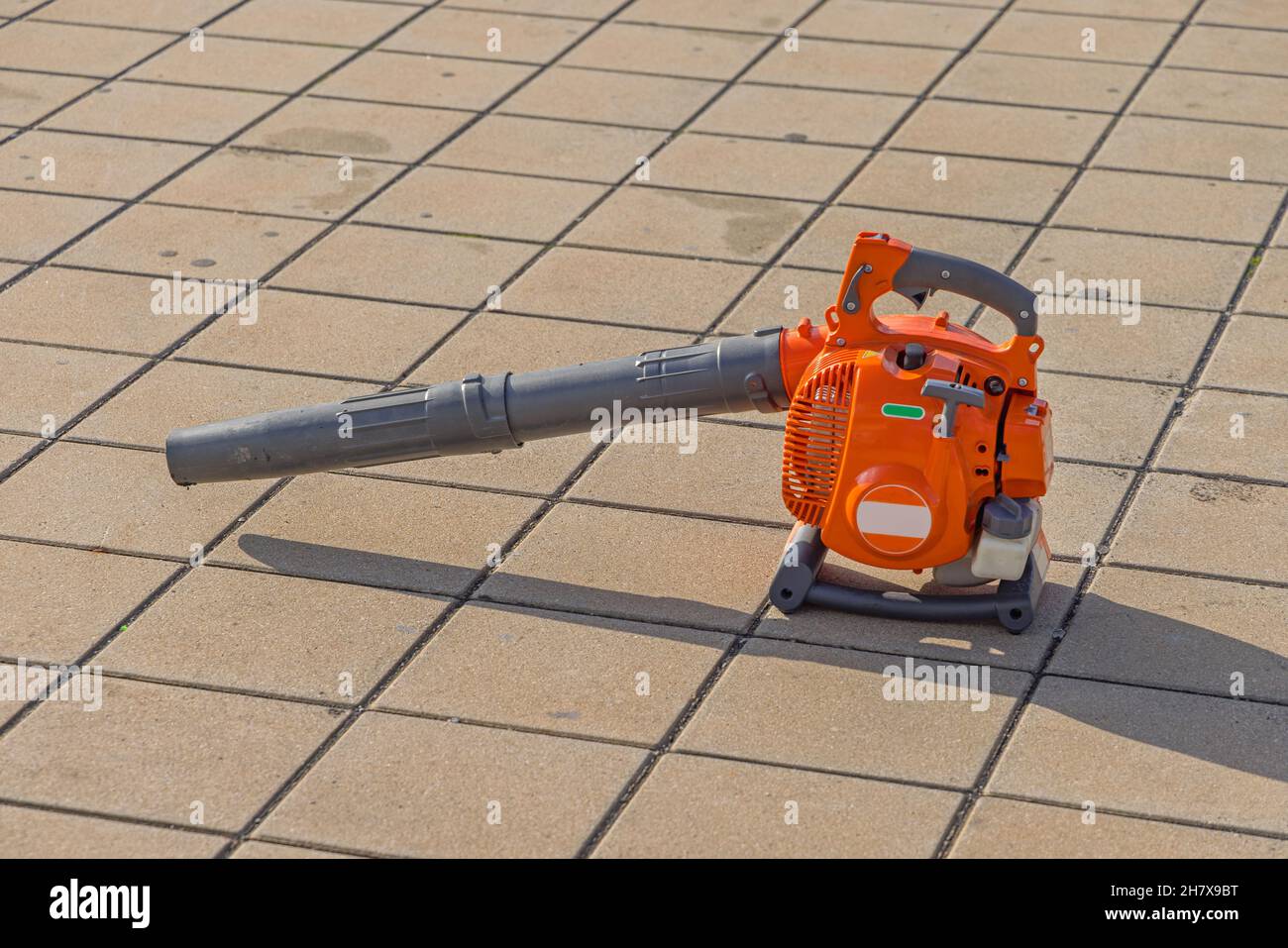 Gas Powered Leaf Blower at Clean Tiled Pavement Stock Photo - Alamy