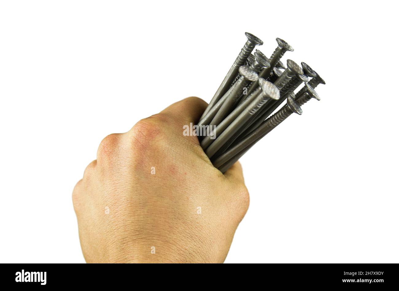 Man holding construction nails in his hand, isolated on white Stock ...