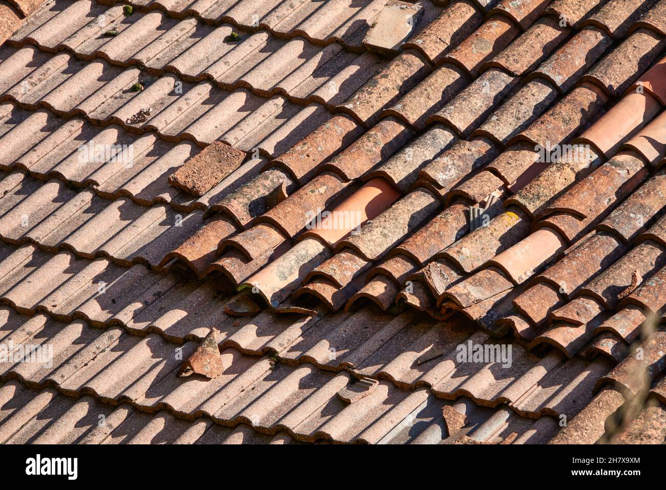 different and damage roof tiles - close up Stock Photo - Alamy