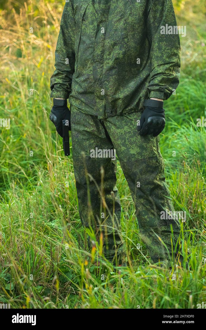 Fully equipped military men with automatic weapons getting ready to ...