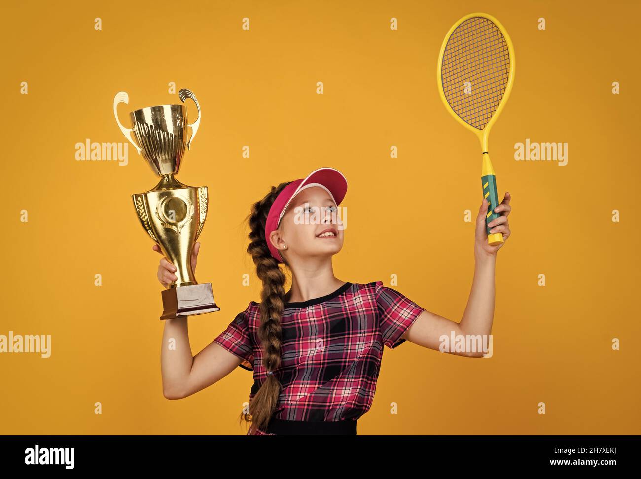 winner child with racquet and champions cup. teen girl win tennis ...