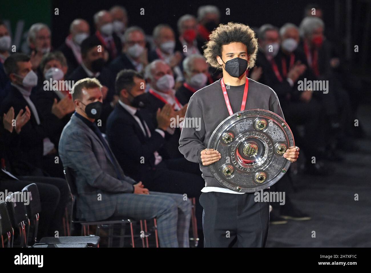 Leroy SANE (FC Bayern Munich) carries the championship trophy into the ...