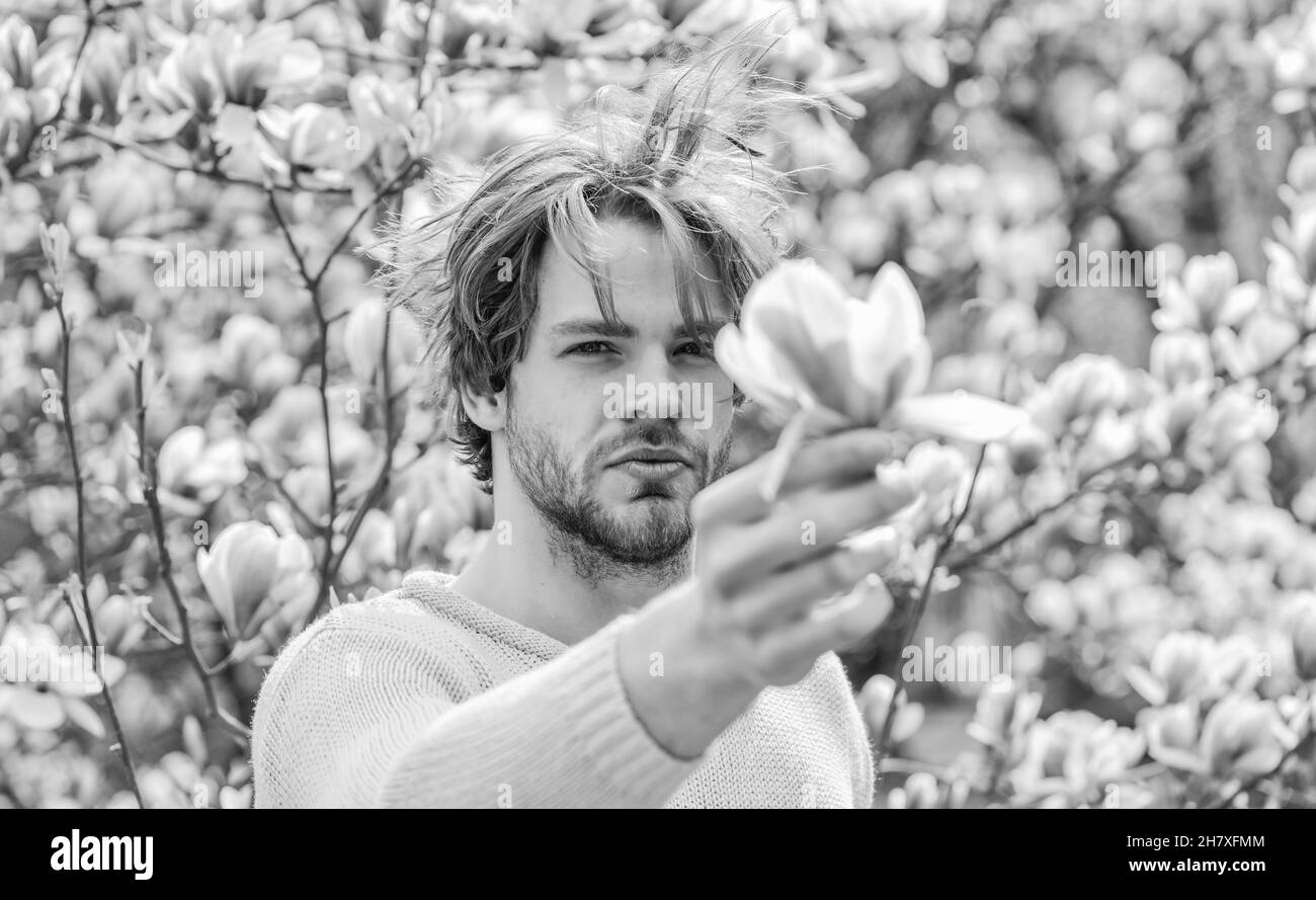 Guy relax in flowers park. Botanical garden. Freshness and awakening ...