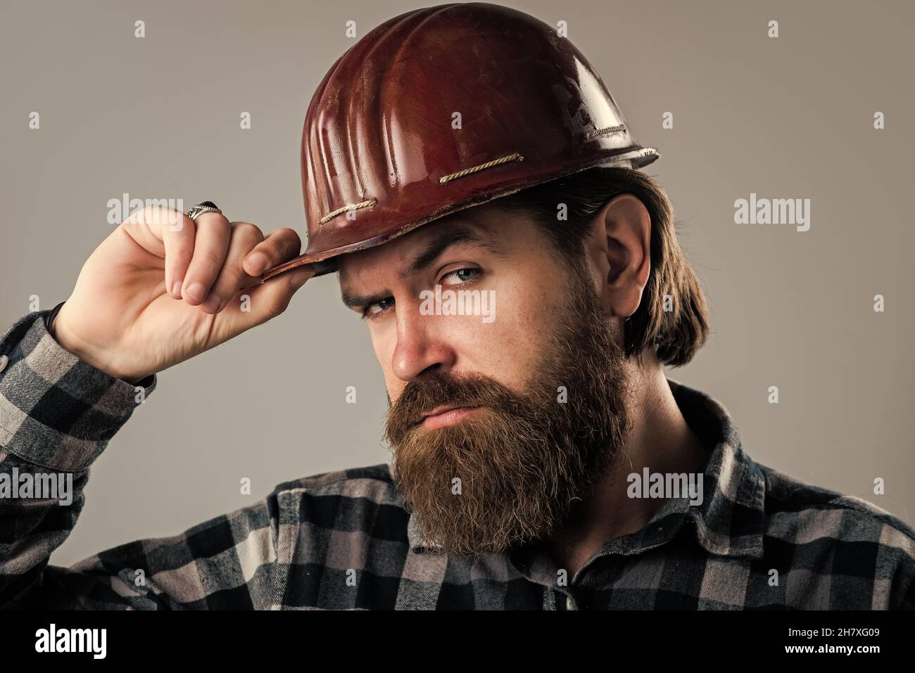 Enjoying his perfect beard. building and repairing. handsome man ...