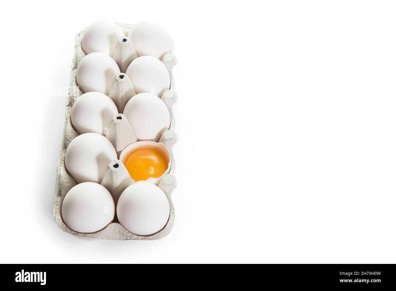 Ten chicken eggs in a grey cardboard container are isolated on the ...