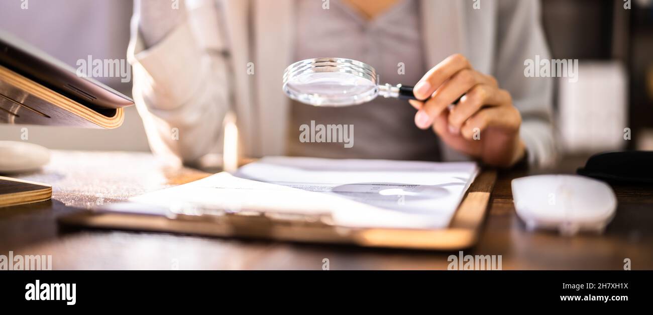 Corporate Auditor Using Magnifying Glass For Tax Fraud Audit Stock ...