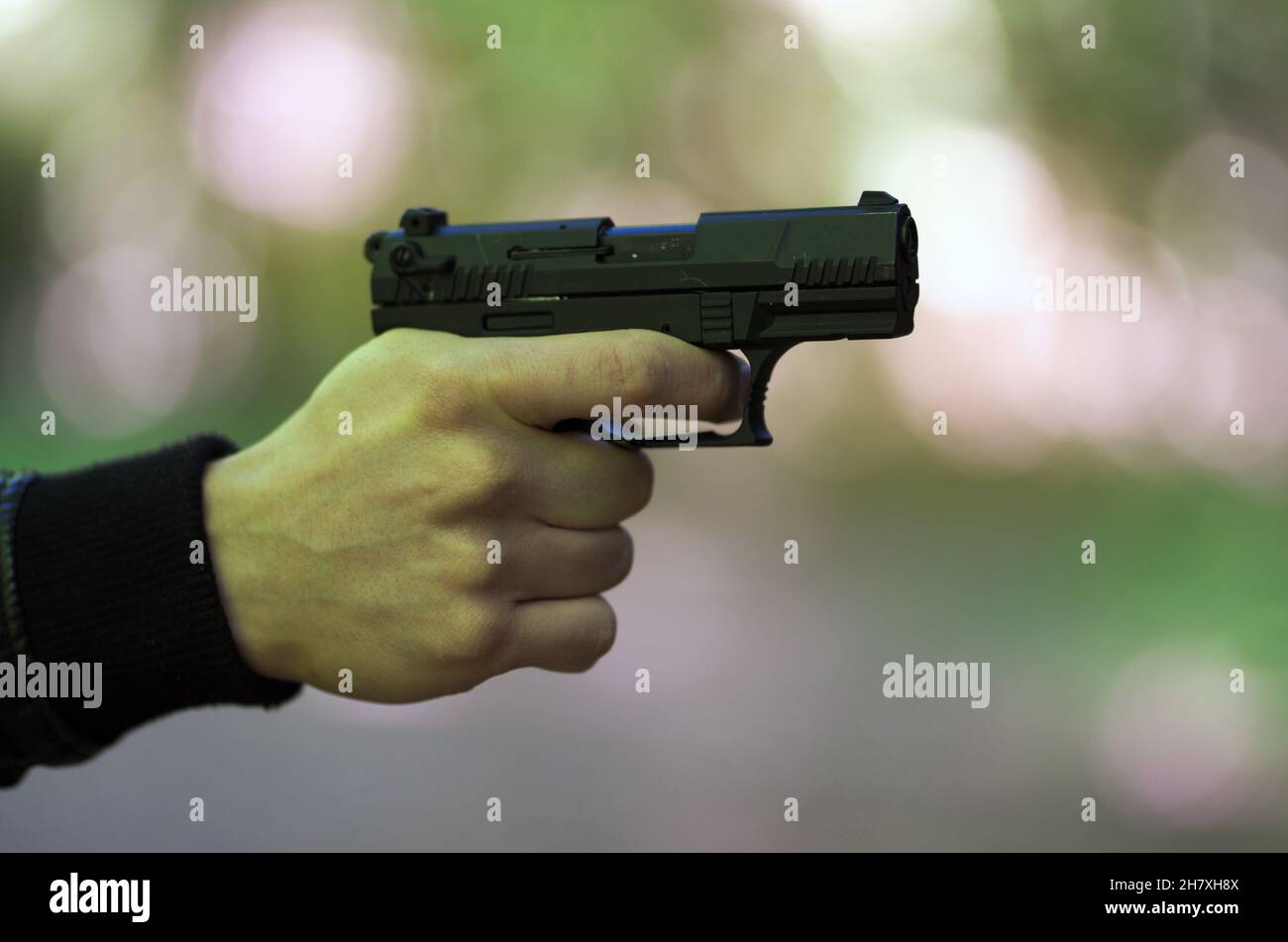 Hand holding gun hi-res stock photography and images - Alamy