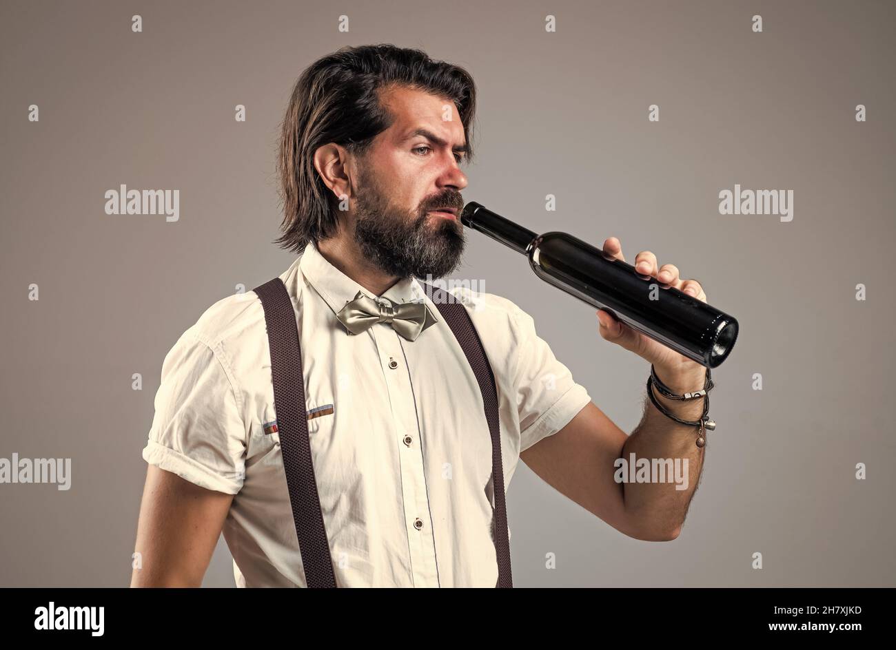 handsome guy hipster with moustache and beard drinking wine, drinking ...