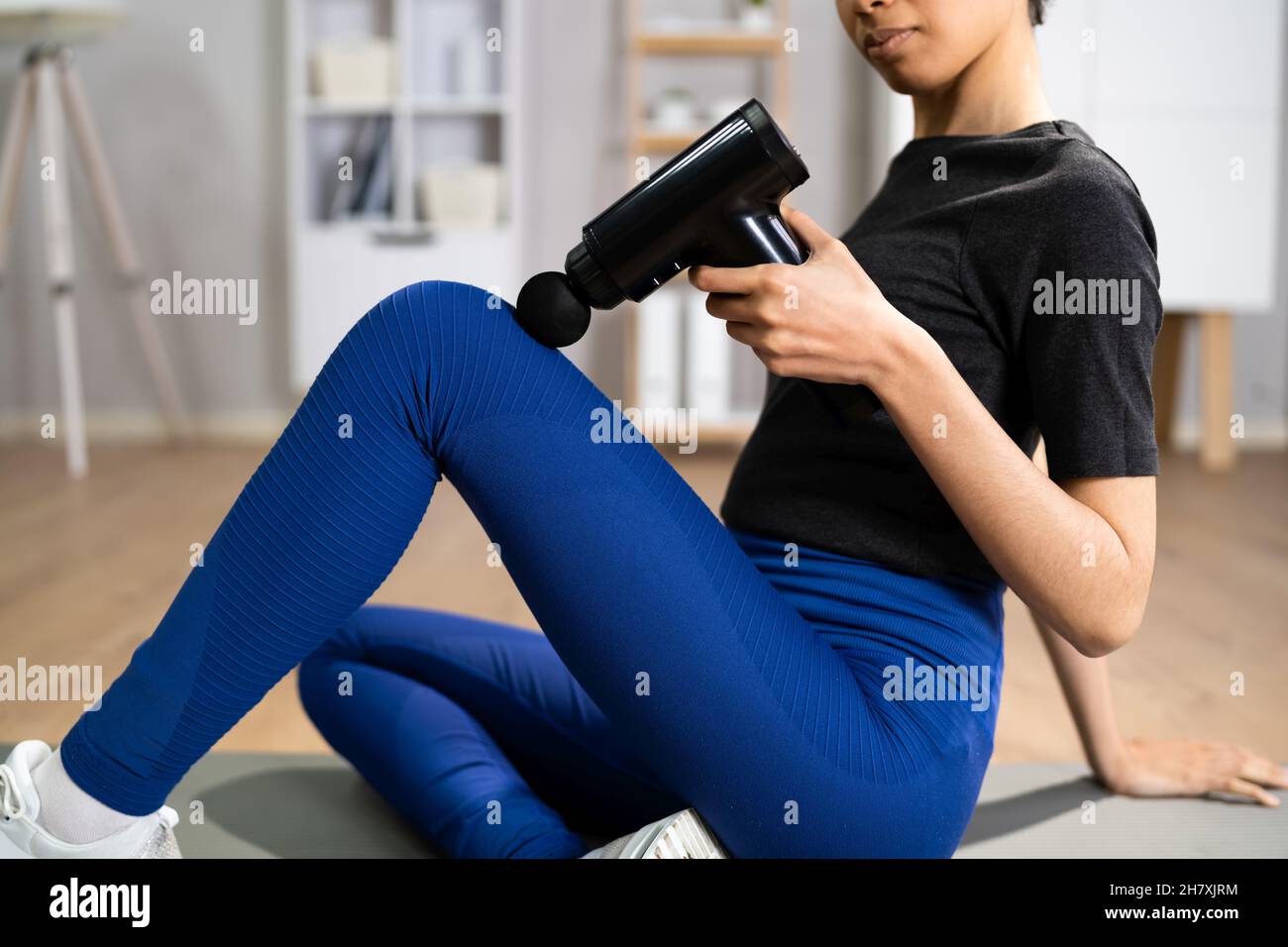 Massage Gun Machine Rehab After Muscle Workout Stock Photo - Alamy