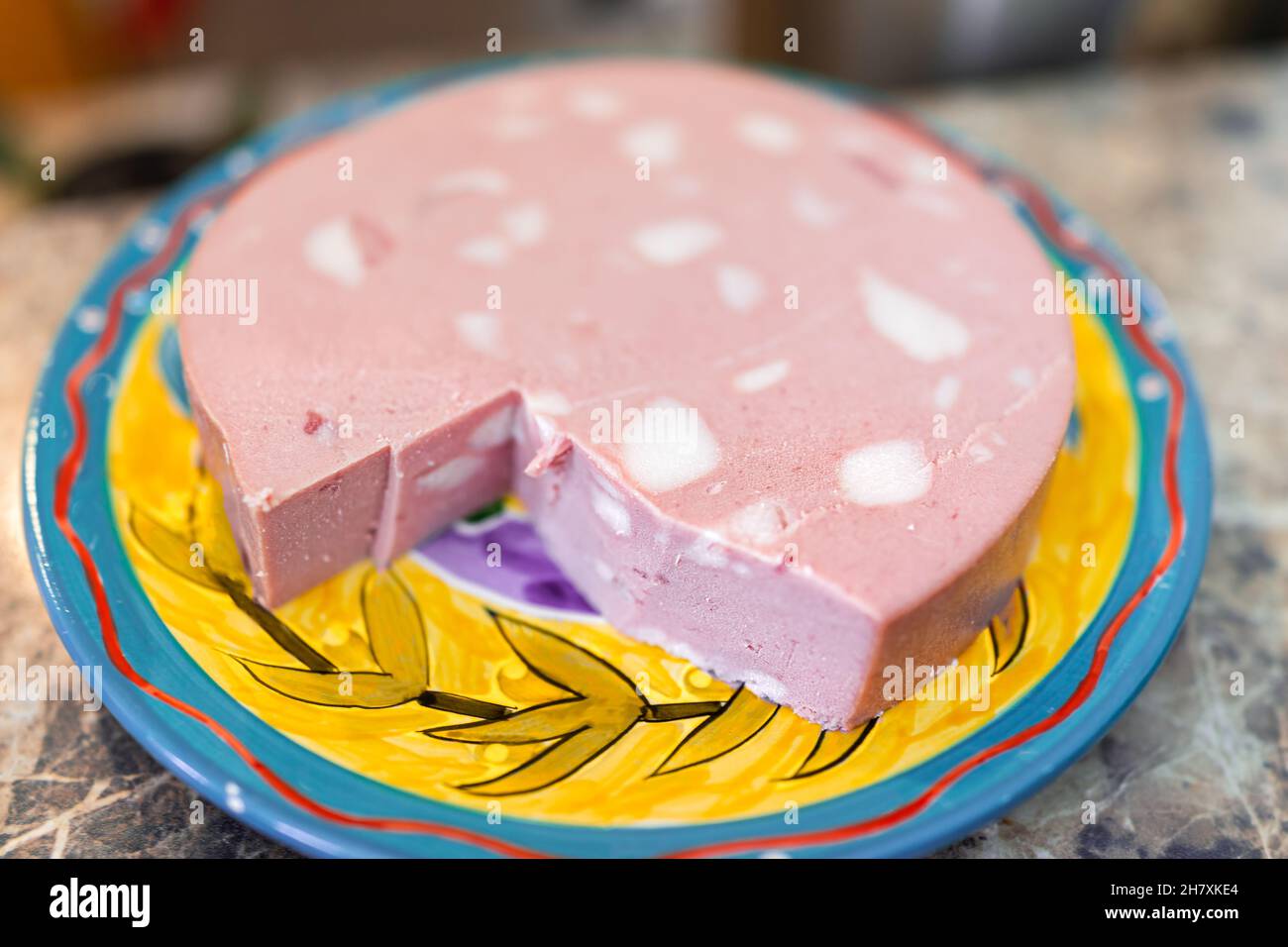Macro closeup of cut pork cured Italian mortadella style sausage soft ...